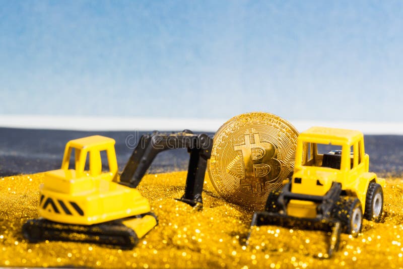 Gold Mining Concept with Construction Engine Toys Stock Photo - Image ...