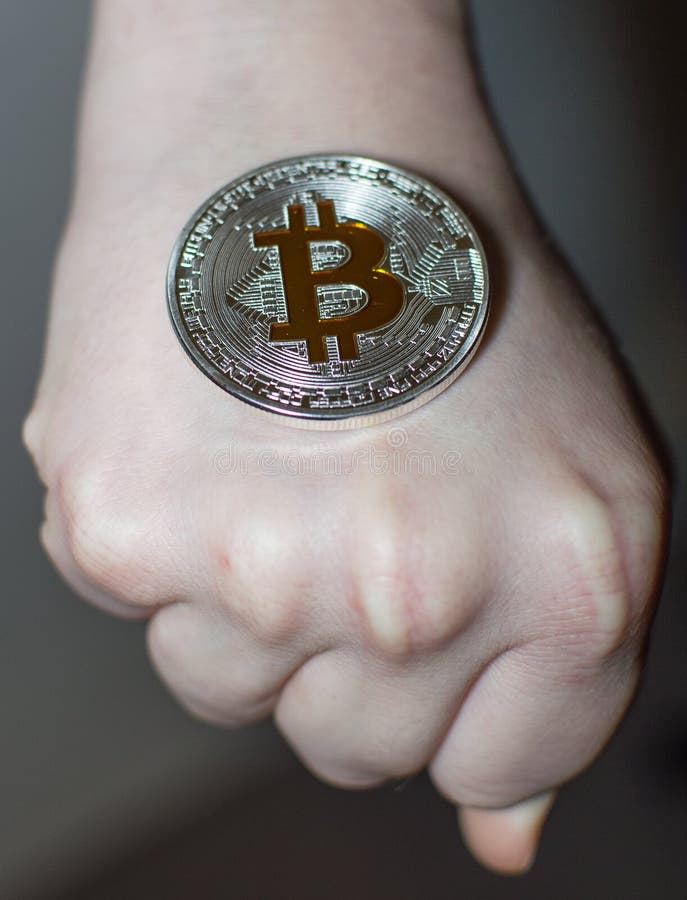Bitcoin in hands stock photo. Image of bitcoin, bills - 108839060