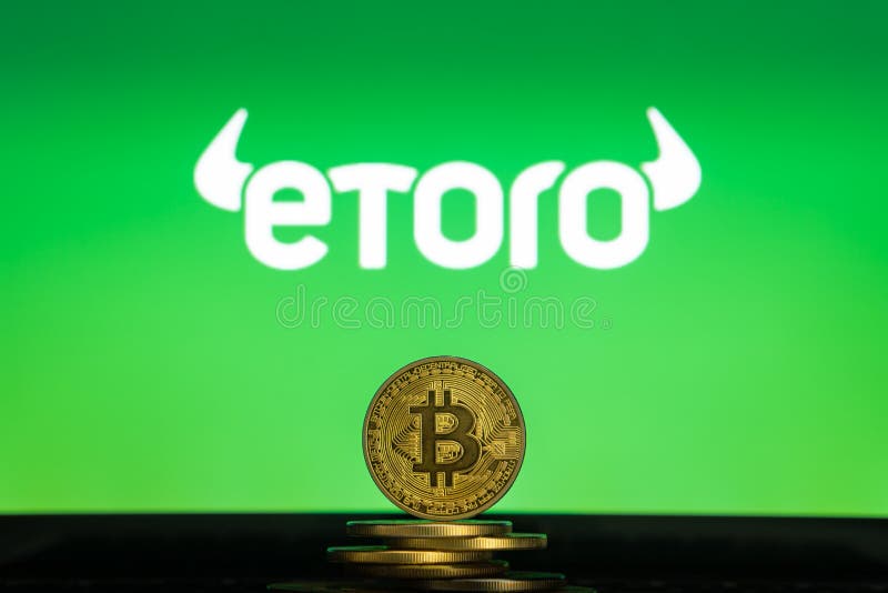 EToro Logo on a Computer Screen with a Stack of Bitcoin Cryptocurency ...