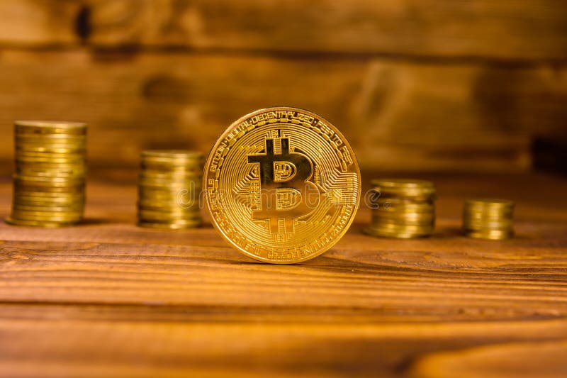 Bitcoin and Stack of Coins on Wooden Table Stock Image - Image of ...