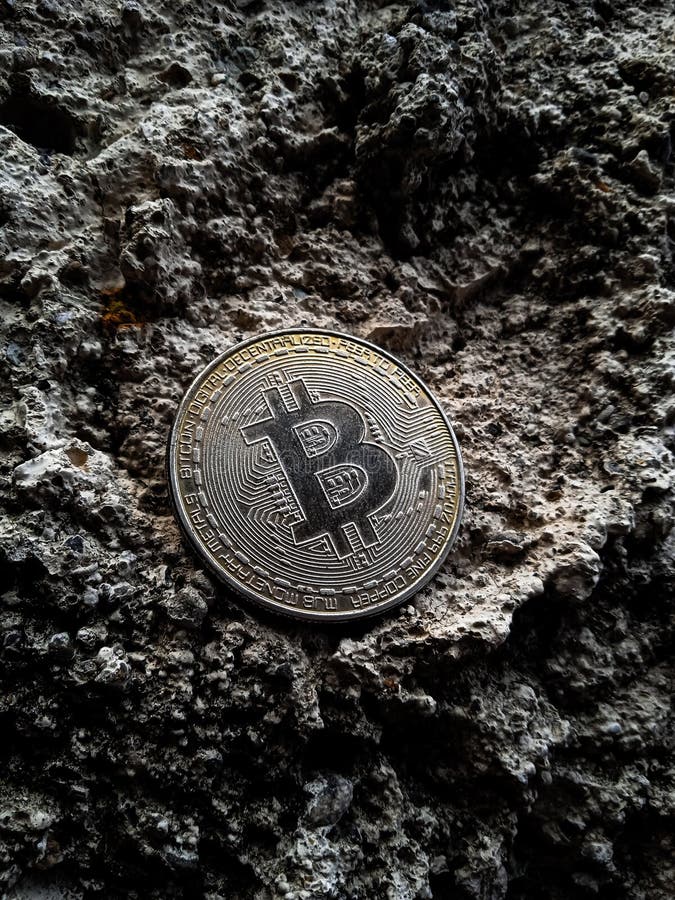 A Bitcoin on a White Rock with Aesthetic Lighting Stock Photo - Image ...