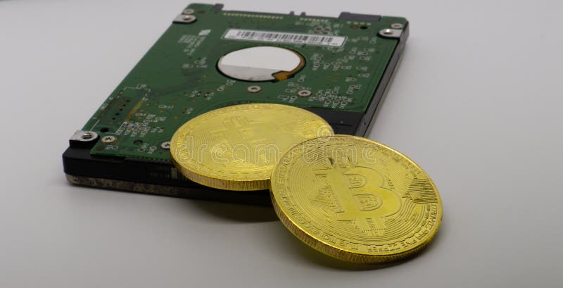 Bitcoins on a harddrive stock photo. Image of hard, banking - 132736292