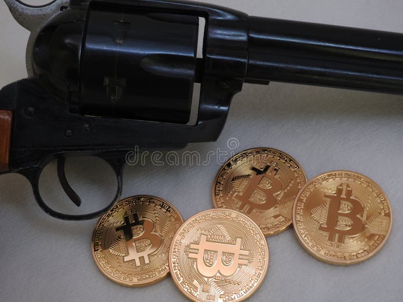 Bitcoins and revolver stock photo. Image of crime, bitcoin - 94314736