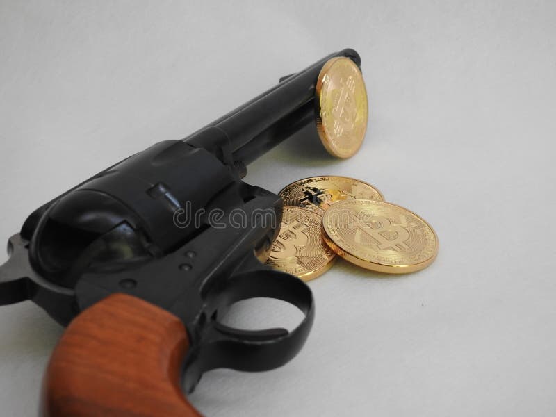 Bitcoins and revolver stock photo. Image of ammunition - 94314886