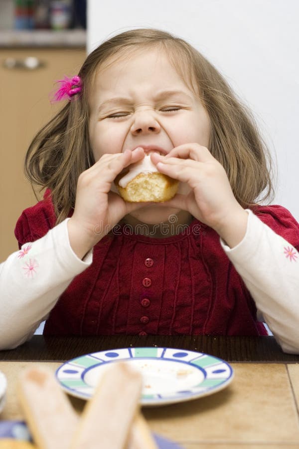 Hungry child eating bread stock image. Image of emotions - 44041255