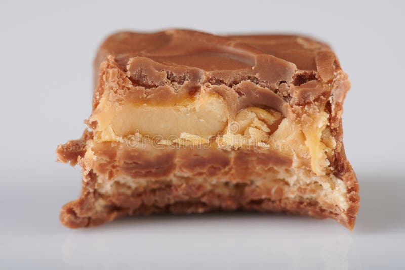 Bite of candy bar stock photo. Image of delicious, broken - 170130484