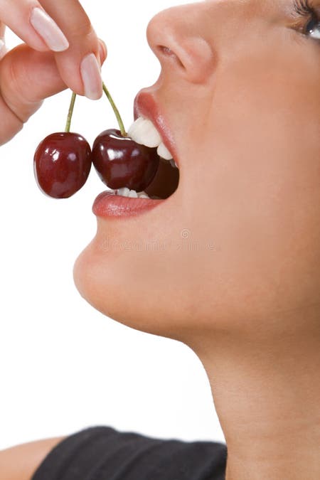Biting into a cherry stock image. Image of nutrition, nails - 5582931