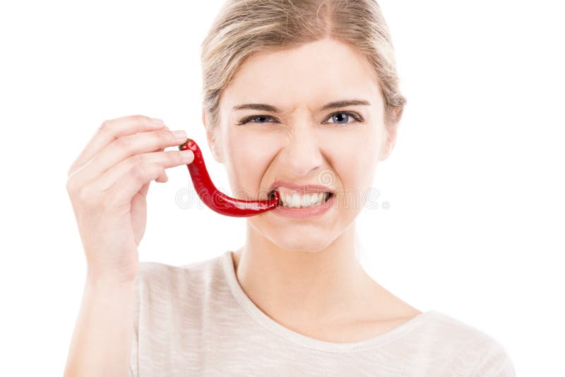 Biting a red chilli pepper stock image. Image of isolated - 32445707