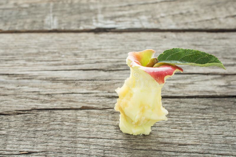 Bitten into Apple Core with Green Leaf Stock Image - Image of bite ...