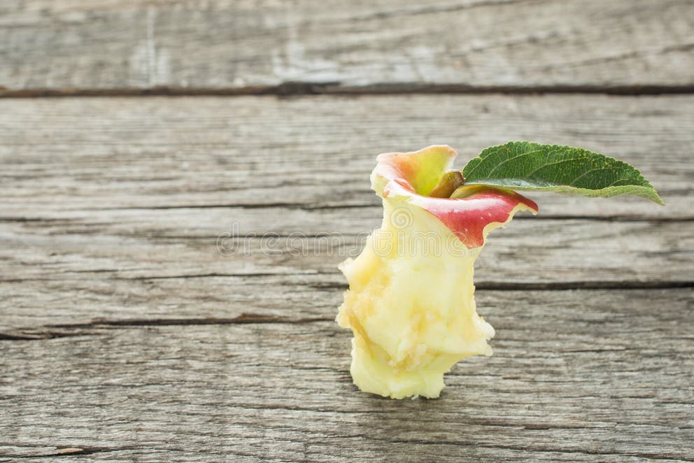 Bitten into Apple Core with Green Leaf Stock Image - Image of bite ...