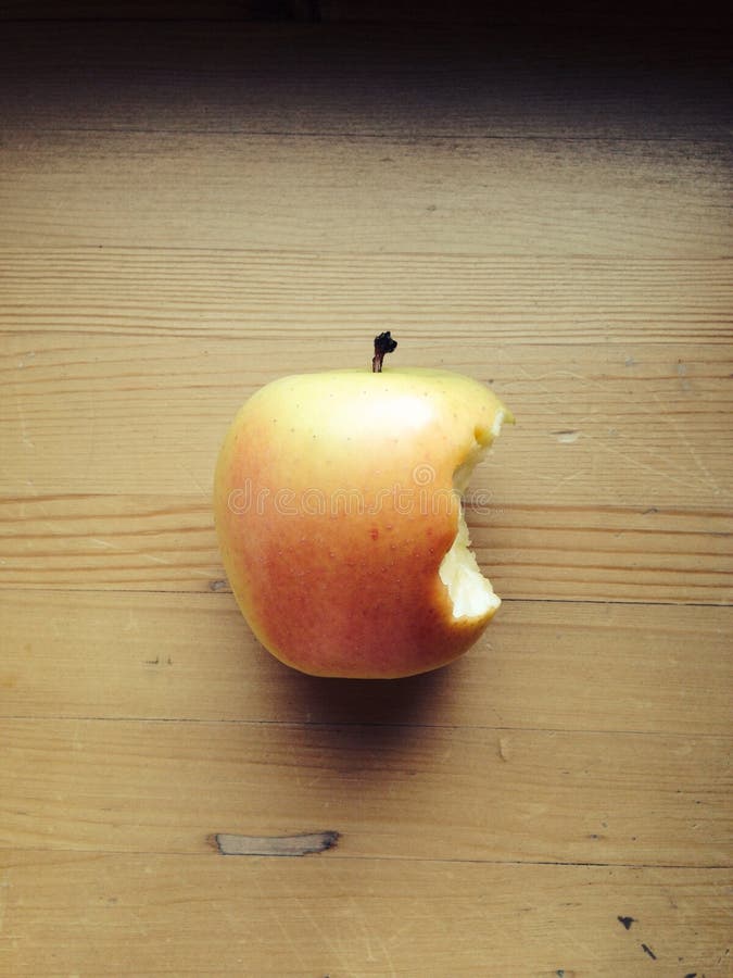 Bitten Apple stock image. Image of single, palm, bite - 1251481