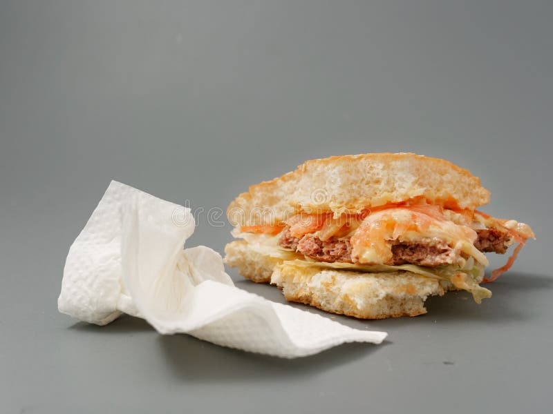 Bitten Big Burger with Cutlet Cheese and Tomato on a Gray Background ...