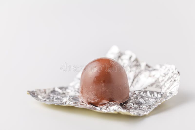 Bitten Chocolate Candy in a Candy Wrapper Stock Photo - Image of junk ...
