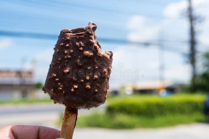 Bitten Chocolate Popsicle Ice Cream Bar with Crushed Peanut Nuts Stock ...