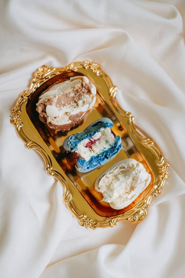Bitten Large Macaroons on a Golden Plate. on a Beautiful White ...