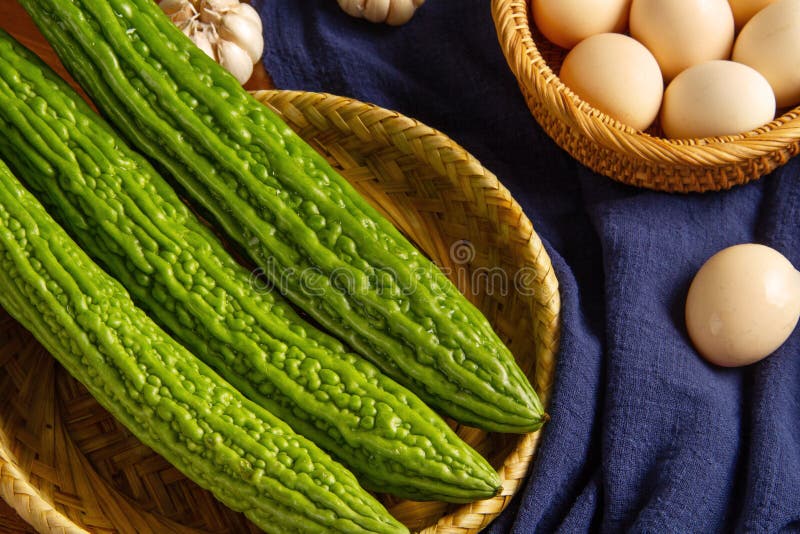 Bitter Gourd and Egg on the Table Stock Photo - Image of bitter ...