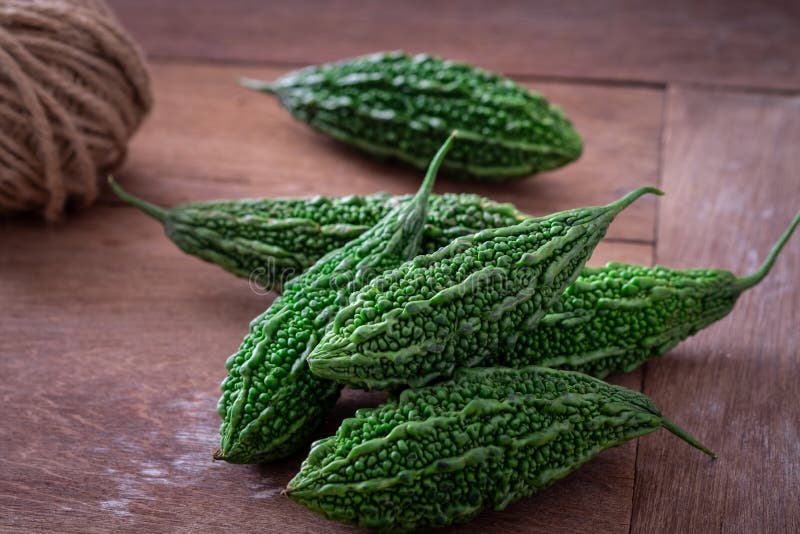 Bitter Gourd or Bitter Melon on Wooden Table Stock Photo - Image of ...