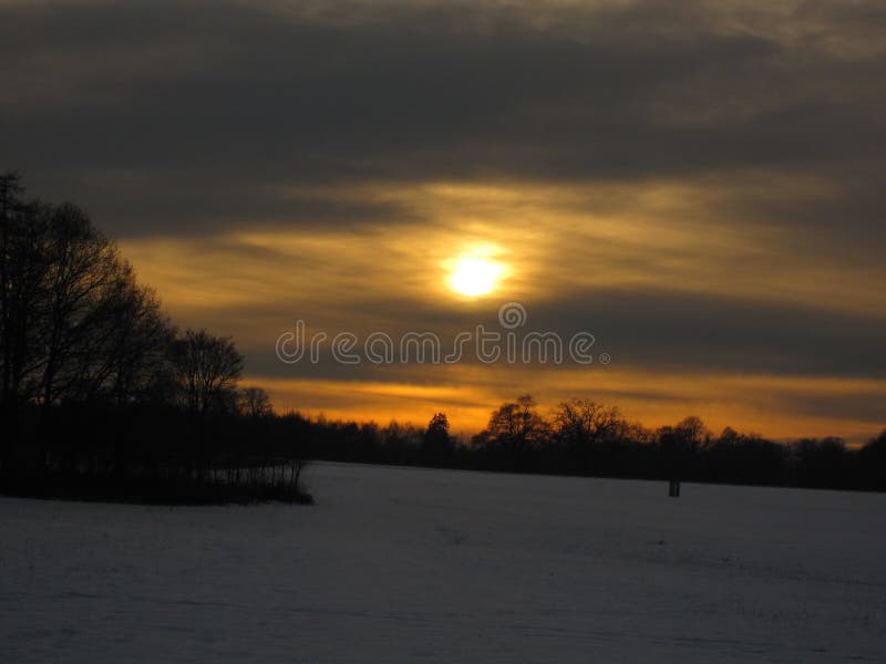 Bitterly Cold Sunset stock image. Image of setting, winter - 105799877