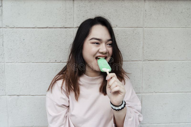 Bitting Ice Cream, Turn Left Stock Image - Image of enjoy, green: 180304135
