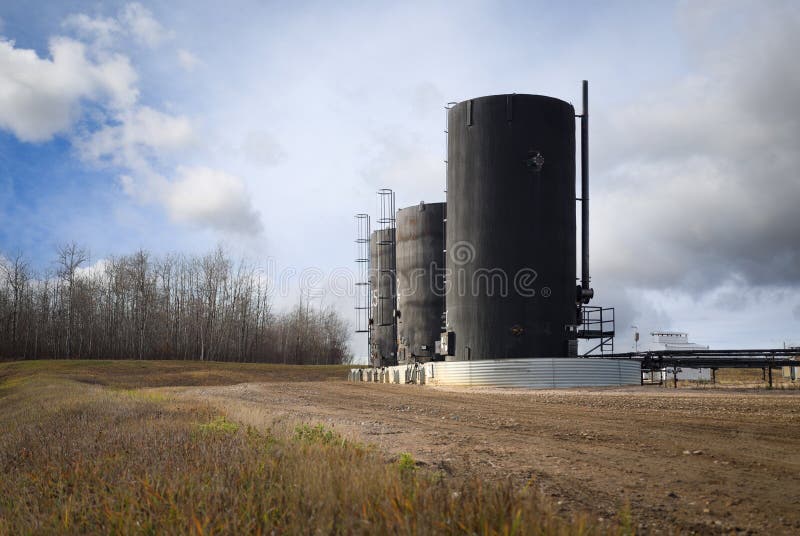 Bitumen Oil Storage Tanks on an Oil Lease Stock Photo - Image of ...