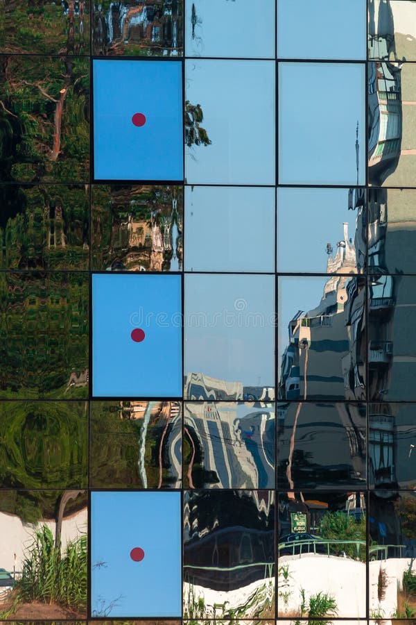 A Bizarre Distorted Reflection of a Residential Building and Trees in ...