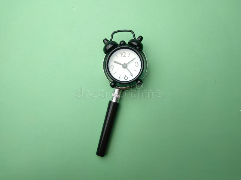 Black Alarm Clock and Magnifying Glass Stock Photo - Image of symbol ... Black Alarm Clock and Magnifying Glass Stock Photo - Image of symbol ...