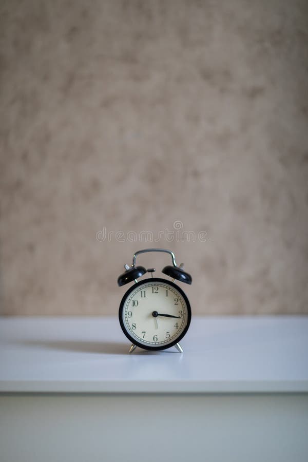 Black Alarm Clock on White Table. Stock Image - Image of school, black ...