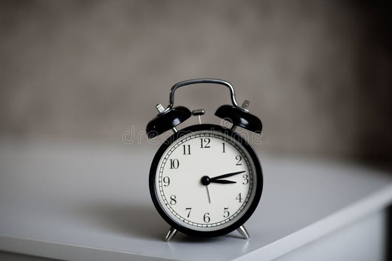 Black Alarm Clock on White Table. Stock Image - Image of back, shift ...