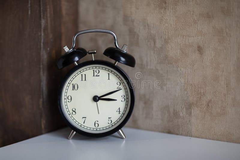 Black Alarm Clock on White Table. Stock Image - Image of business ...