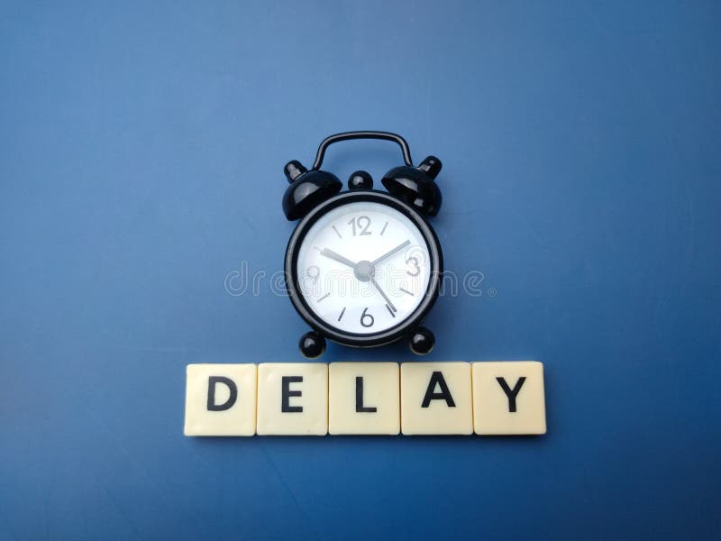 Black Alarm Clock with the Word DELAY Stock Image - Image of morning ...