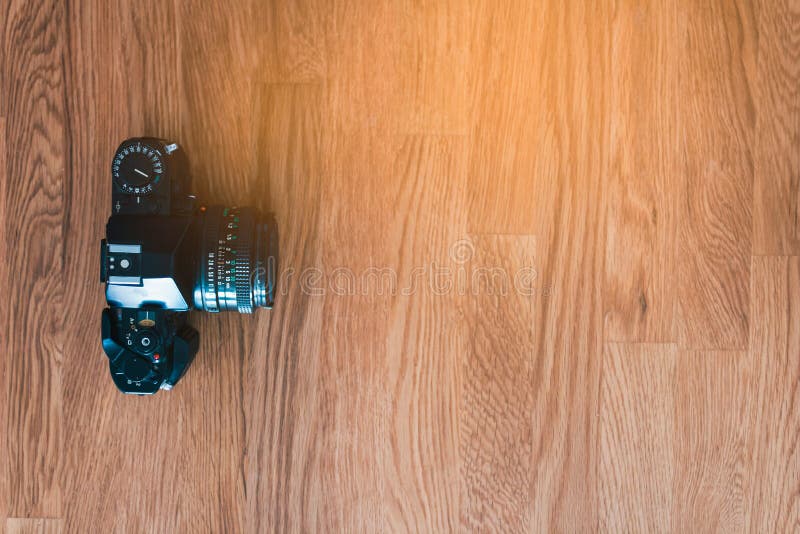 Black Analog Camera on Wooden Desk. Top View Stock Photo - Image of ...