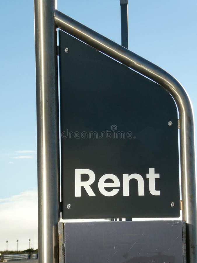 Black Angled Sign Outside on a Pole that Says Rent in White Letters ...
