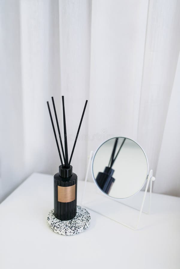 Black Aroma Diffuser with Round Mirror on a White Table. Relax Spa ...