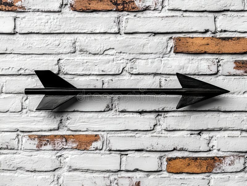A Black Arrow on a White Brick Wall Stock Image - Image of uneven ...
