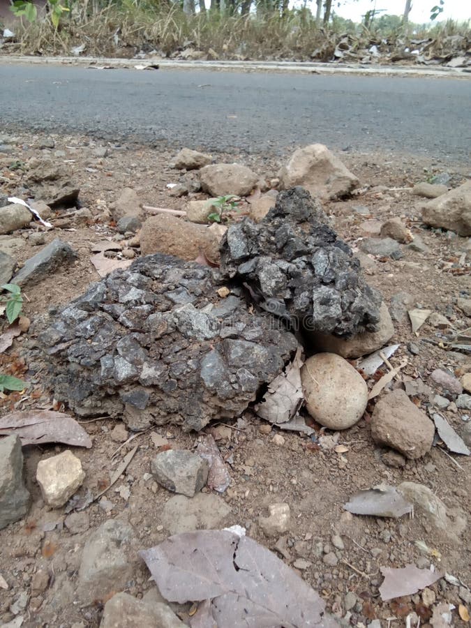 Black Asphalt and Stone are the Remains of Road Paving Stock Image ...