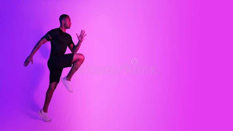 Black Athlete Guy Jumping Exercising during Training on Purple ...