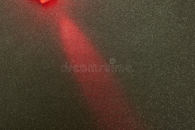 On a Black Background in Fine White Grain a Red Diagonal Beam of Light ...