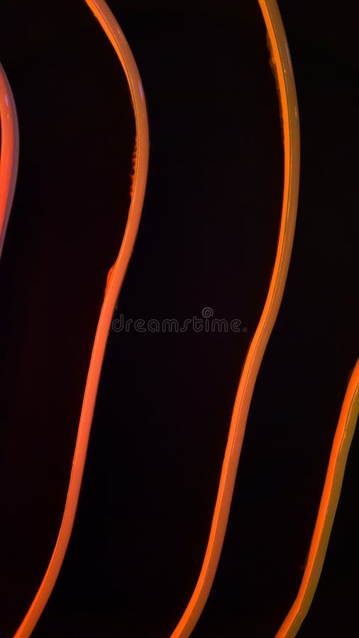 Black Background Illuminated with Orange Neon Light Tubes Stock Image ...