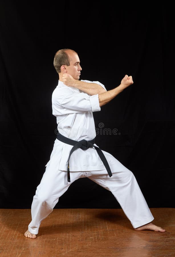 On a Black Background, the Master Trains Karate Blocks Stock Image ...
