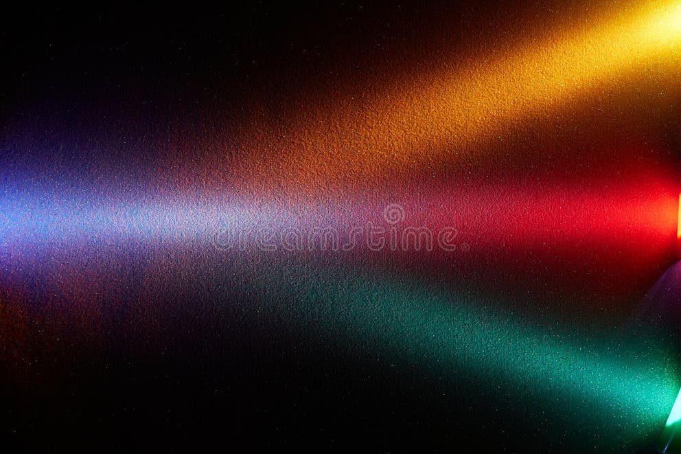 On a Black Background, Multi-colored Wide Beams of Light with a ...