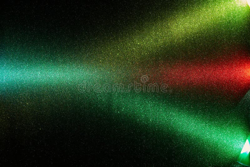 On a Black Background, Multi-colored Wide Beams of Light Turn into ...