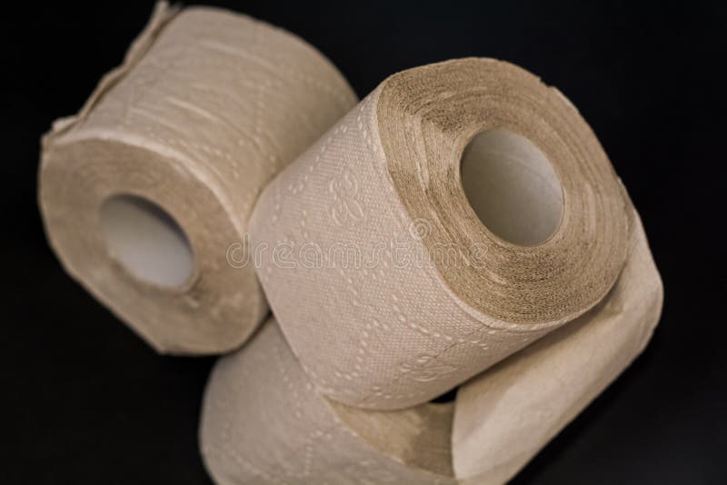 On Black Background, Three Piles of Grey Open Toilet Paper. Stock Photo ...