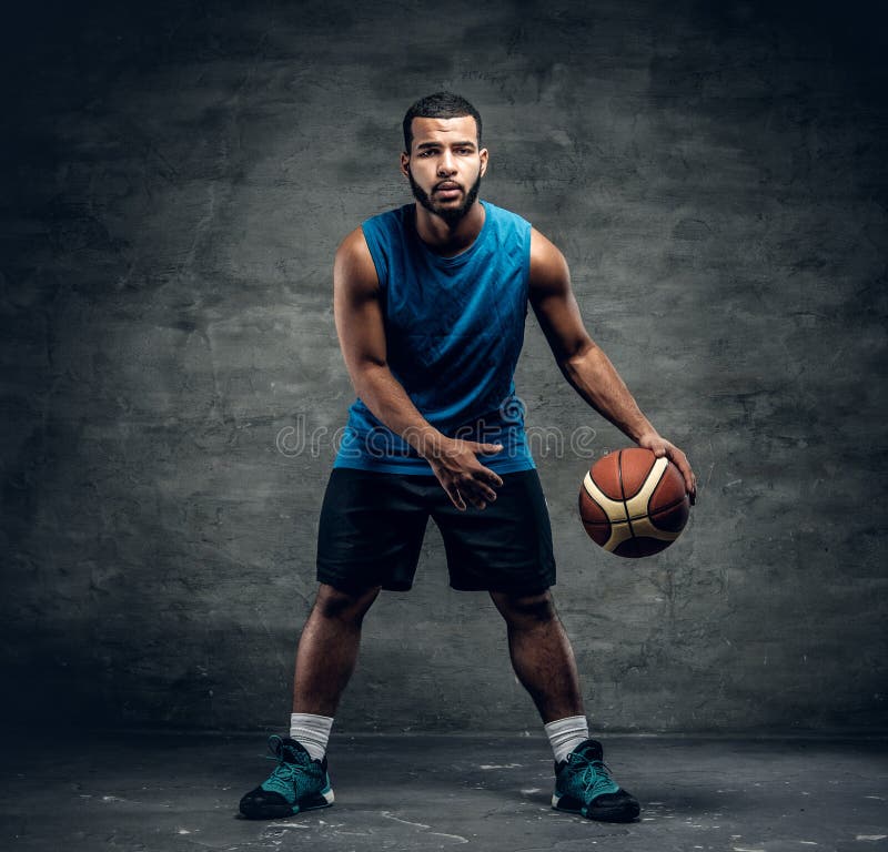 Black Basketball Player in Action in a Basketball Court. Stock Image ...