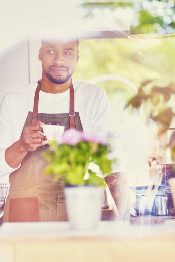 Black Bearded Coffee Seller Pouring Coffee. Stock Photo - Image of ...