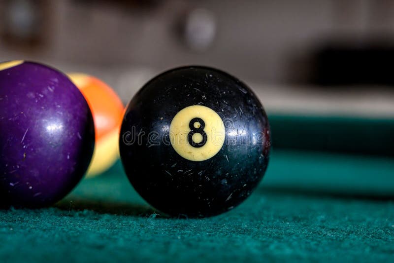 Black Billiard Ball with the Number 8 on a Green Billiard Table Stock ...