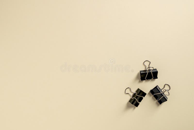 Black Binder Clip Photographed on a Brown Table Stock Image - Image of ...