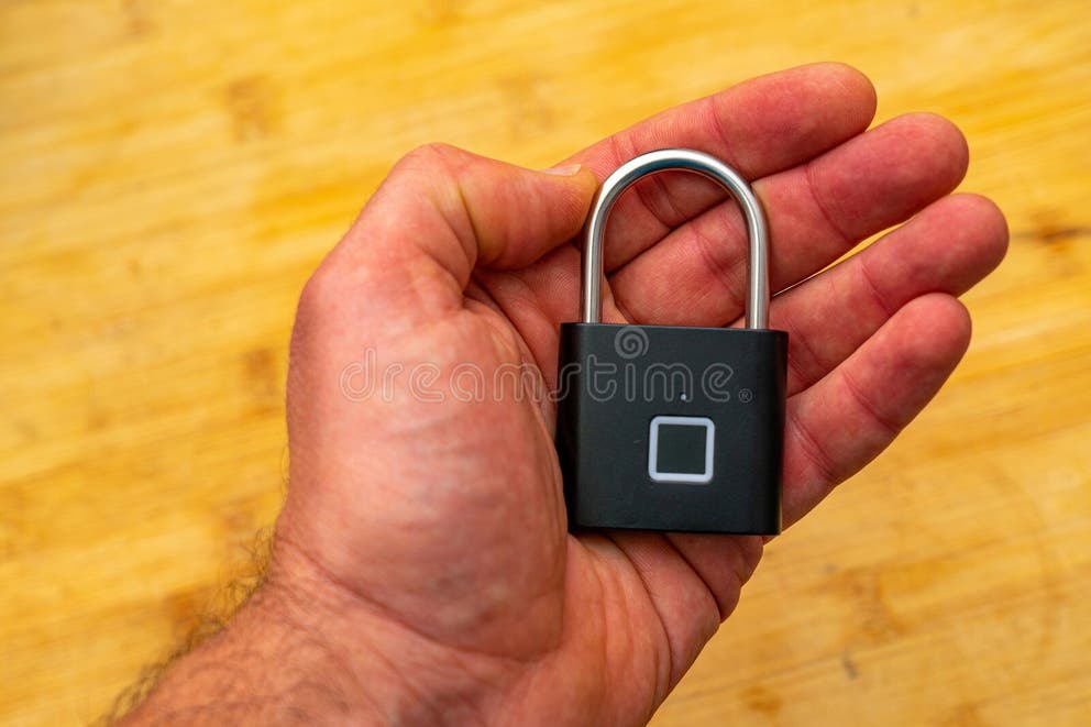 Black Biometric Padlock with Fingerprint Opening Via Square Sensor Held ...
