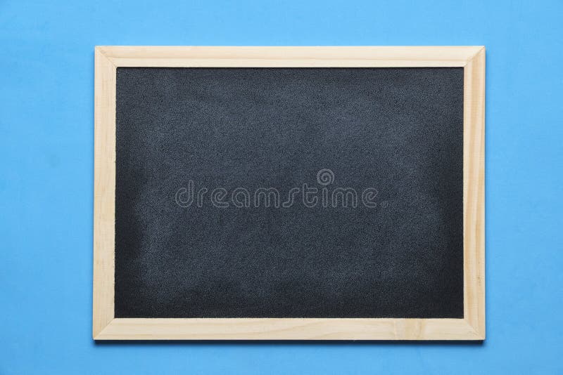 Black Blackboard for Notes in Wooden Frame Blue Background. Stock Image ...