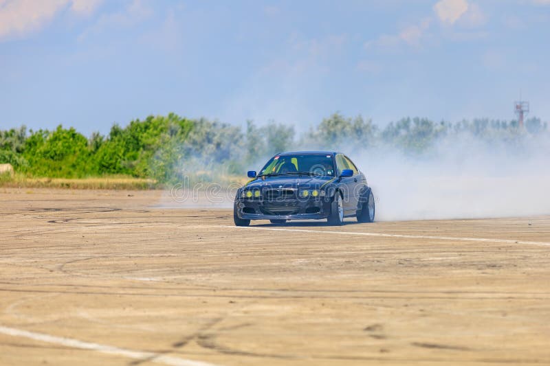 Black BMW Drifting with Intense Smoke Effect on Open Track. July 2 ...