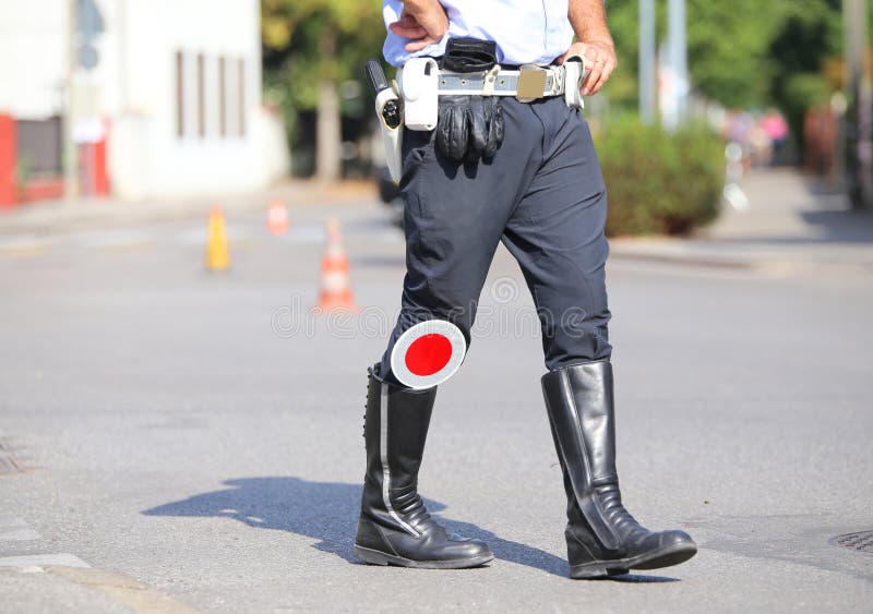 Policeman with the Paddle while Directing Traffic Stock Image - Image ...